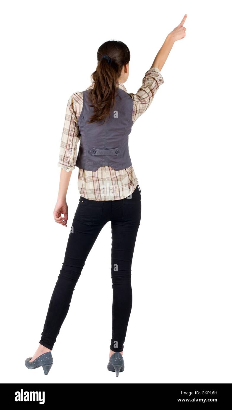 Back view of young brunette woman pointing Stock Photo - Alamy