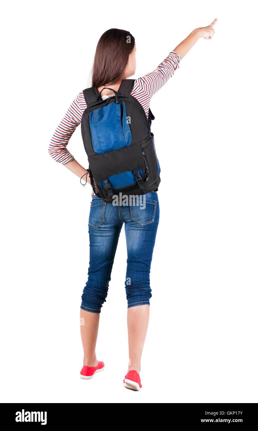 Back view of pointing woman with backpack looking up Stock Photo - Alamy