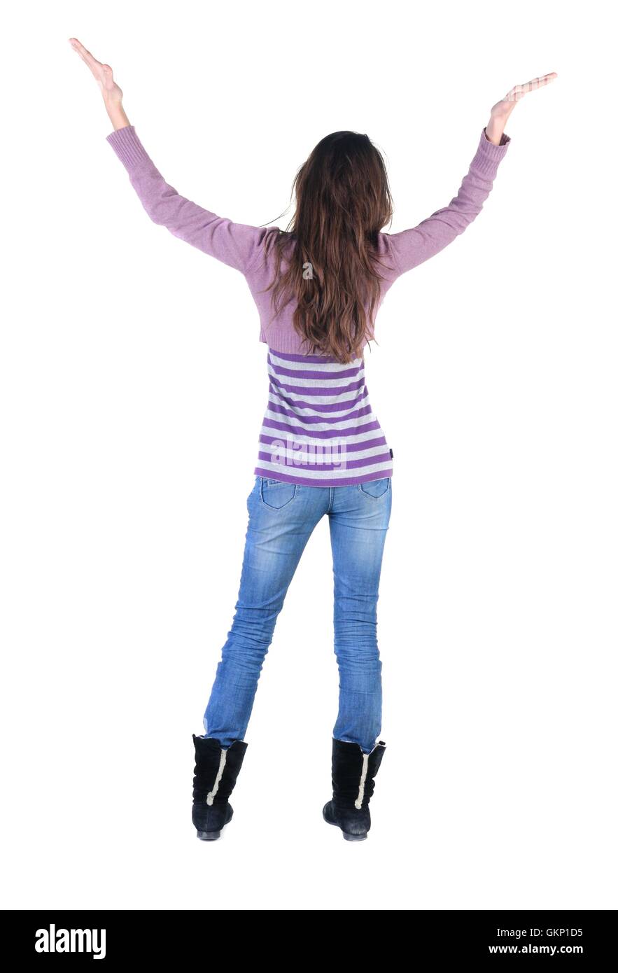 Beautiful young woman looking at wall Stock Photo - Alamy