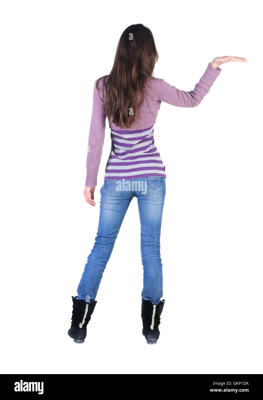 Beautiful young woman looking at wall Stock Photo - Alamy