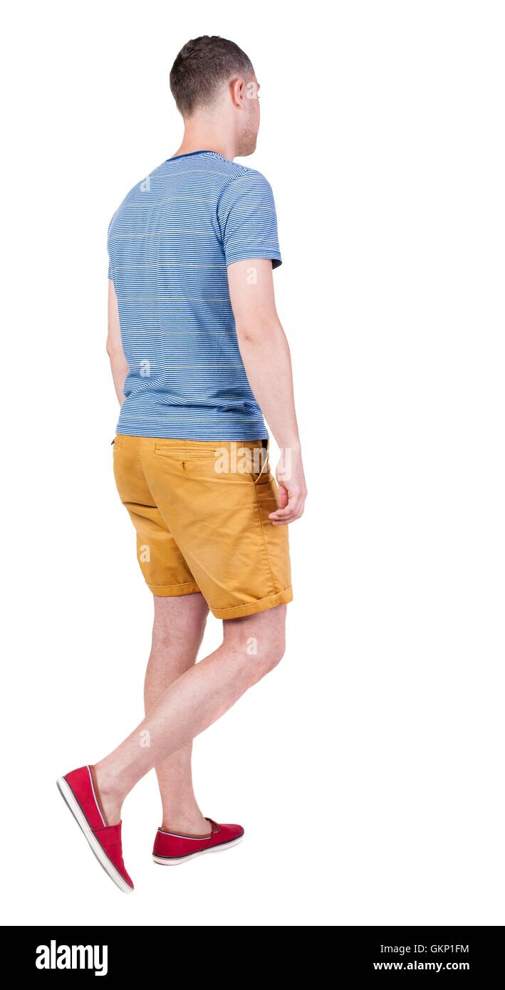 Back view of going handsome man in shorts. walking young guy Stock ...