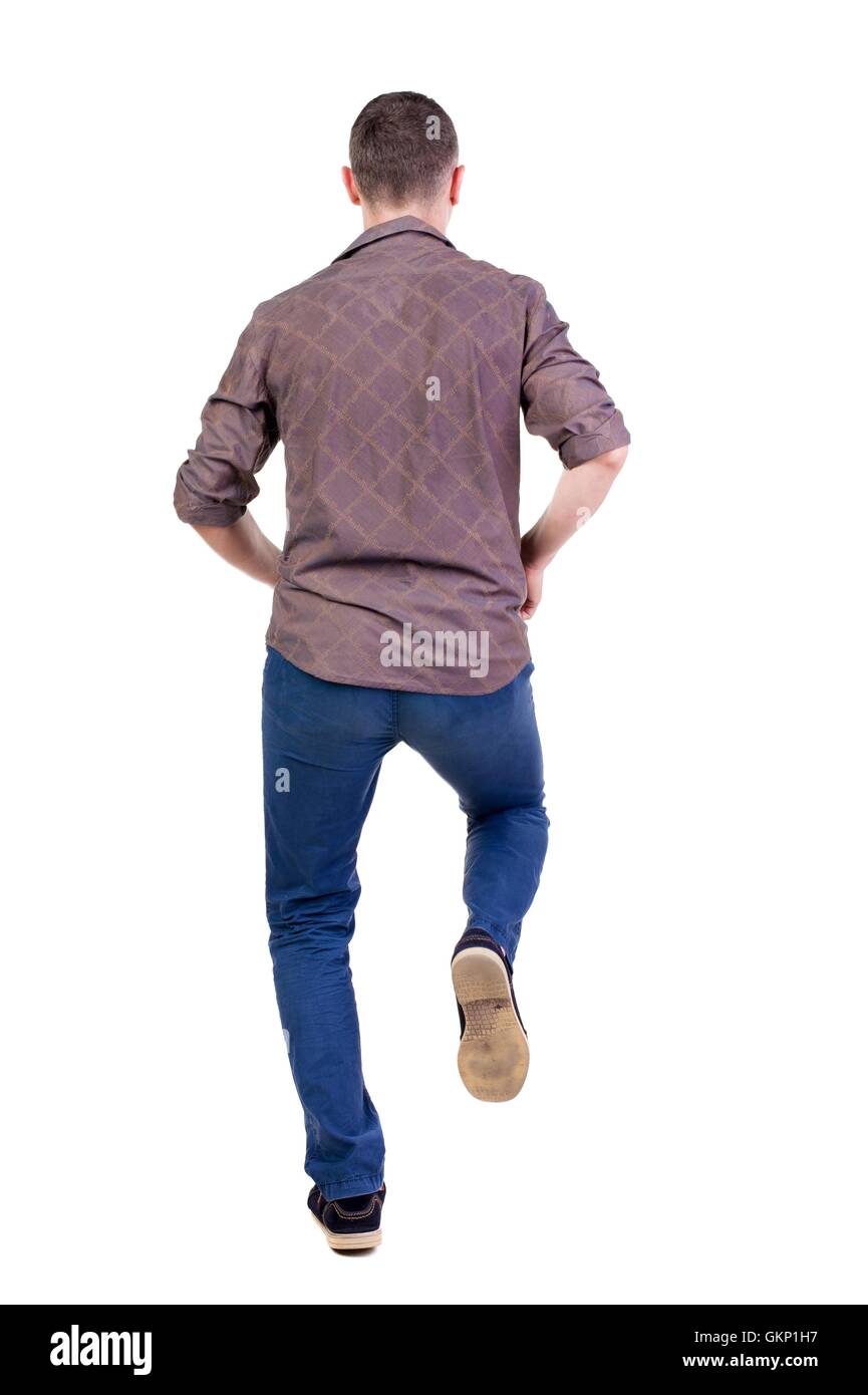Back view of running man in brown shirt Stock Photo - Alamy