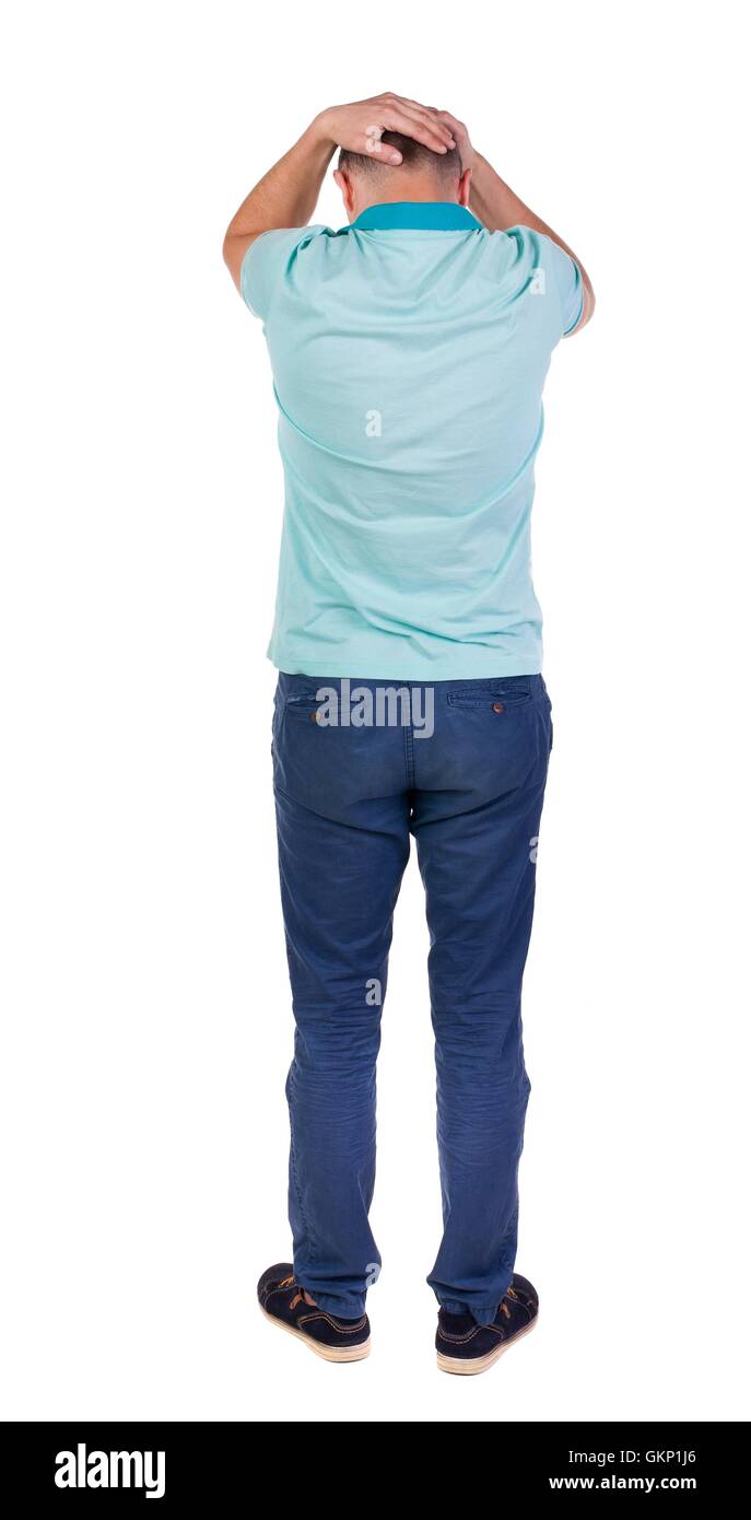 Back view of angry young man in jeans and shirt Stock Photo - Alamy