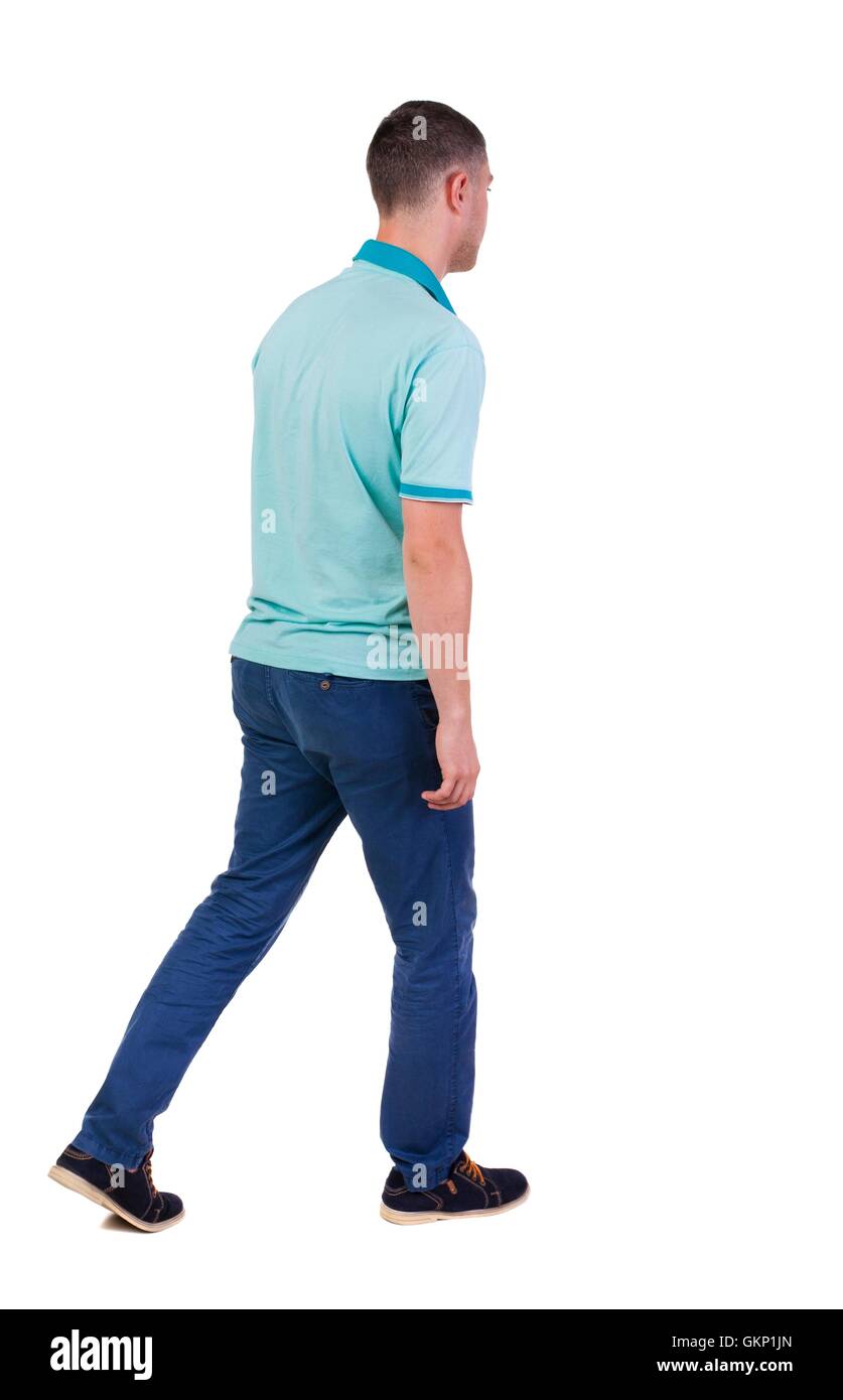 Back view of going handsome man in jeans and a shirt Stock Photo - Alamy
