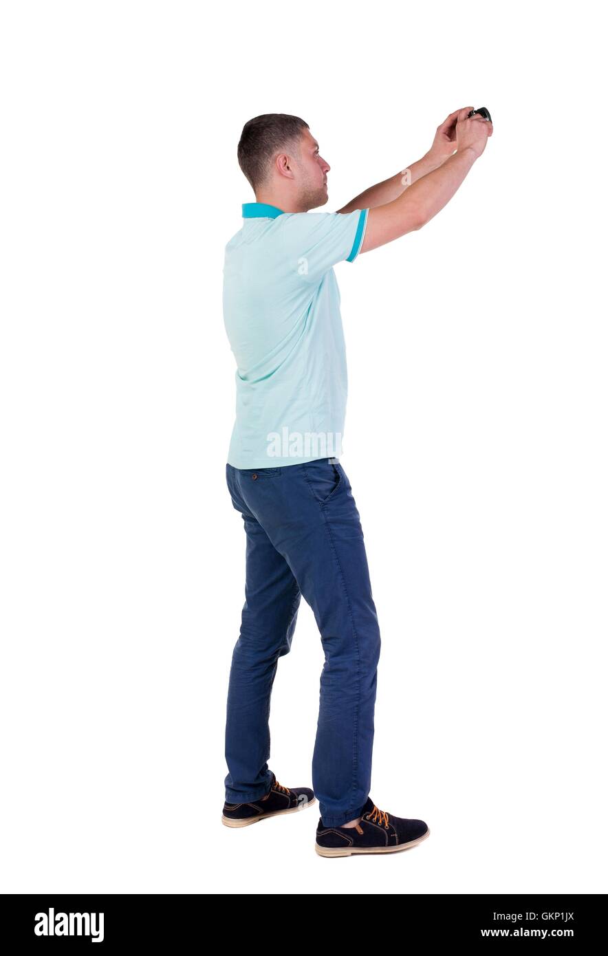 Back view of man photographing. tourist with camera Stock Photo - Alamy