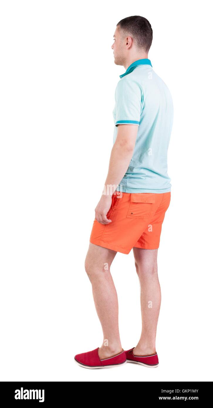 Back view of going handsome man in shorts. walking young guy Stock ...