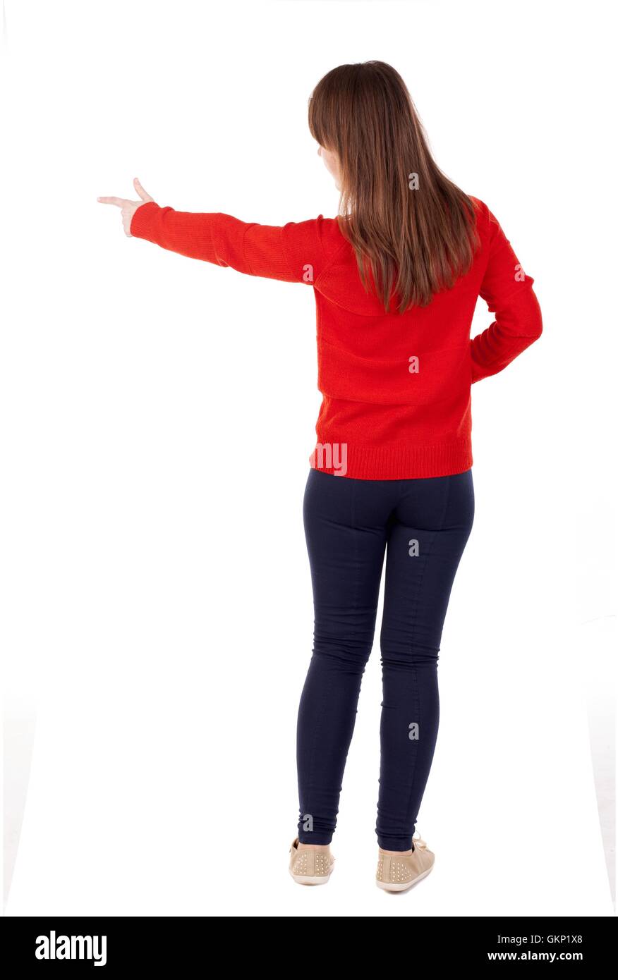 Back view of pointing woman Stock Photo - Alamy