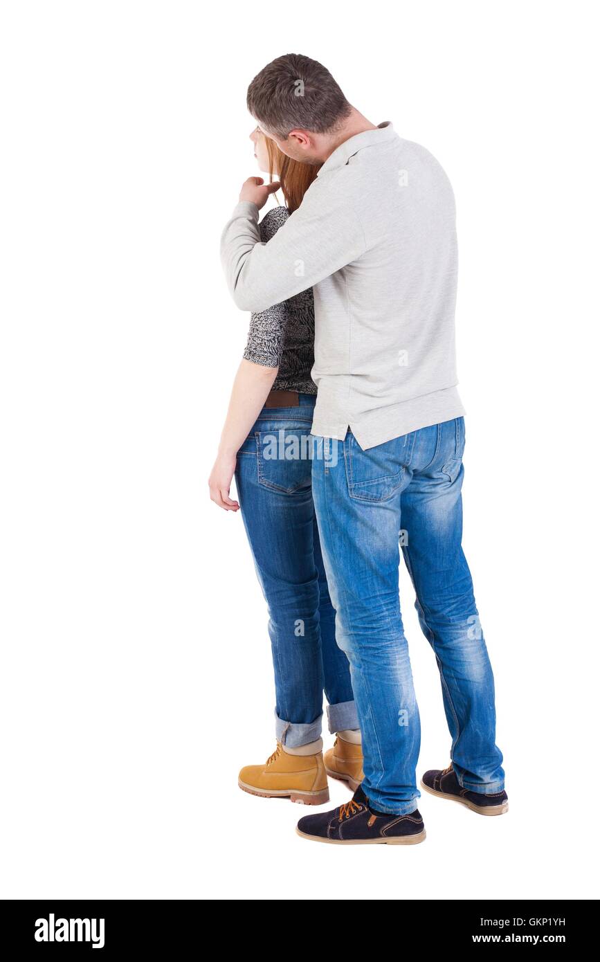 Back view of young embracing couple (man and woman) hug and look Stock ...