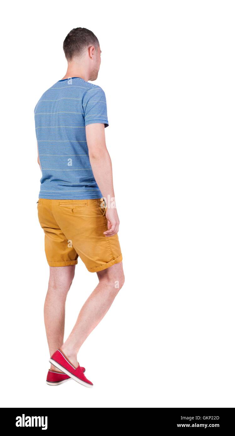 Back view of going handsome man in shorts. walking young guy Stock ...
