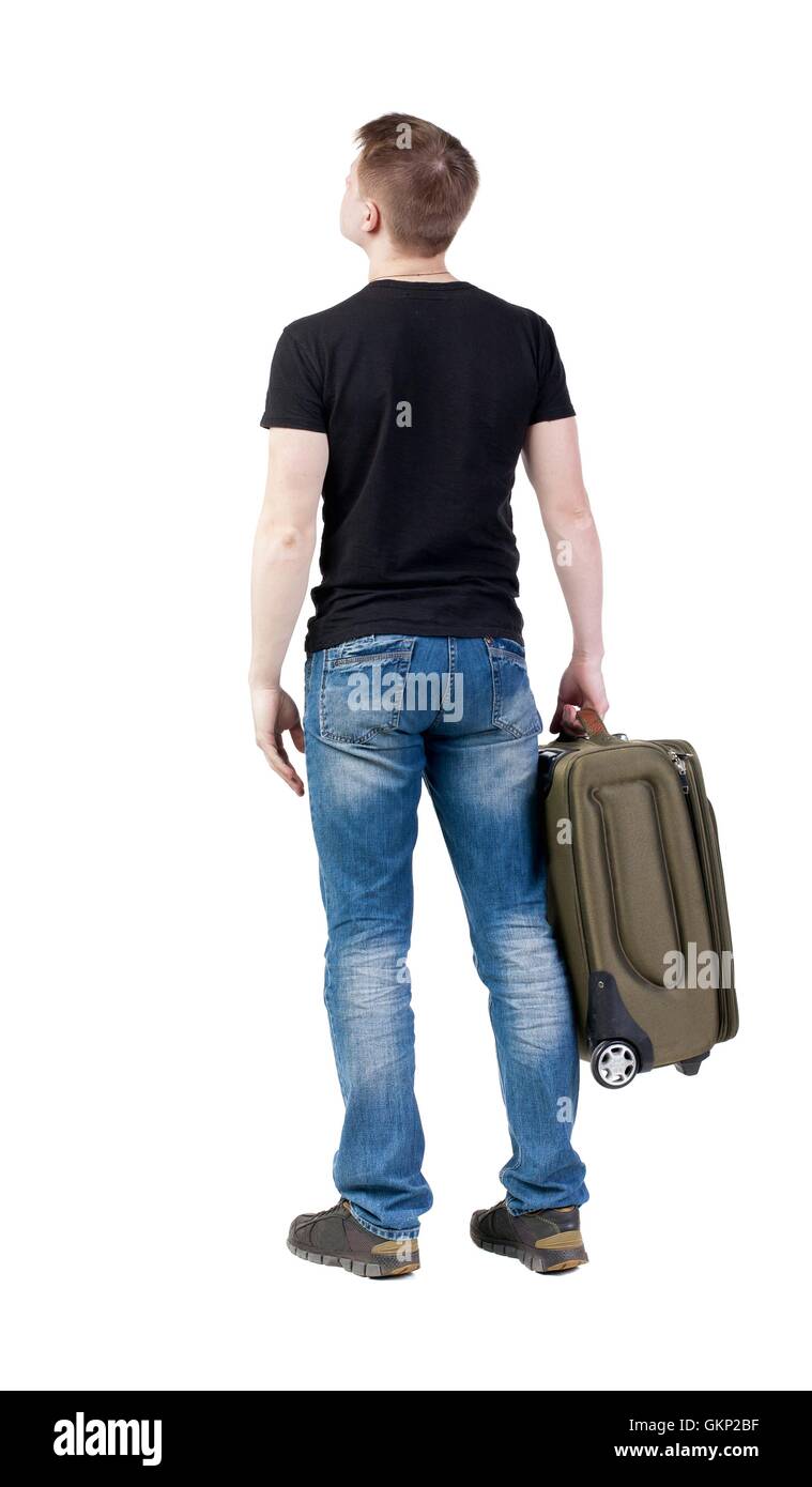 Back view of man with green suitcase looking up Stock Photo - Alamy