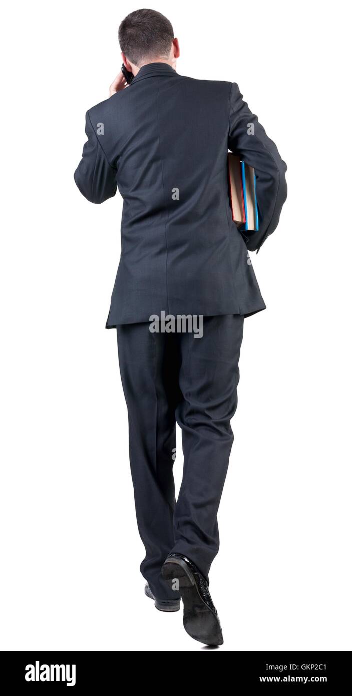 back view of walking business man with books Stock Photo - Alamy