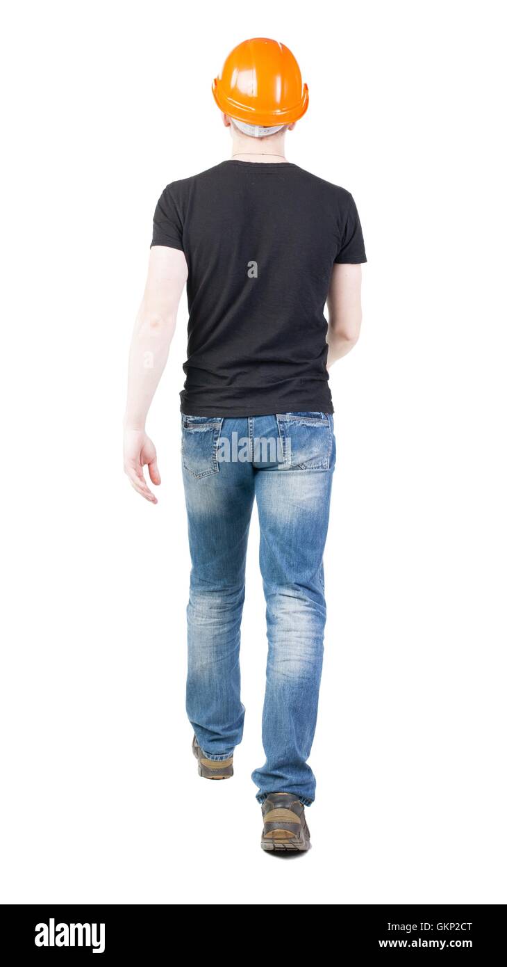 Back view of going engineer in construction helmet Stock Photo - Alamy