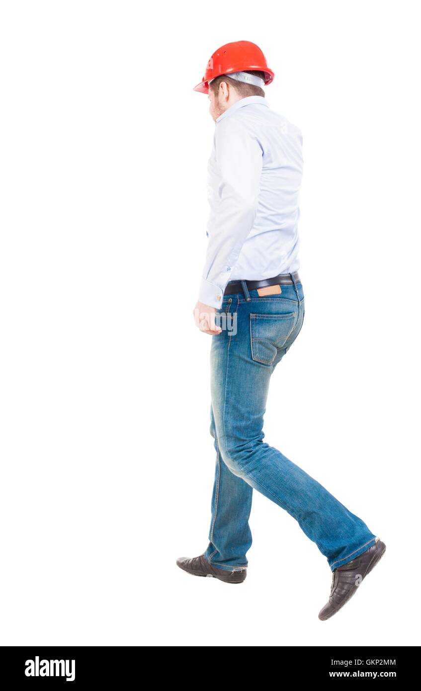 Back view of walking engineer in helmet Stock Photo - Alamy