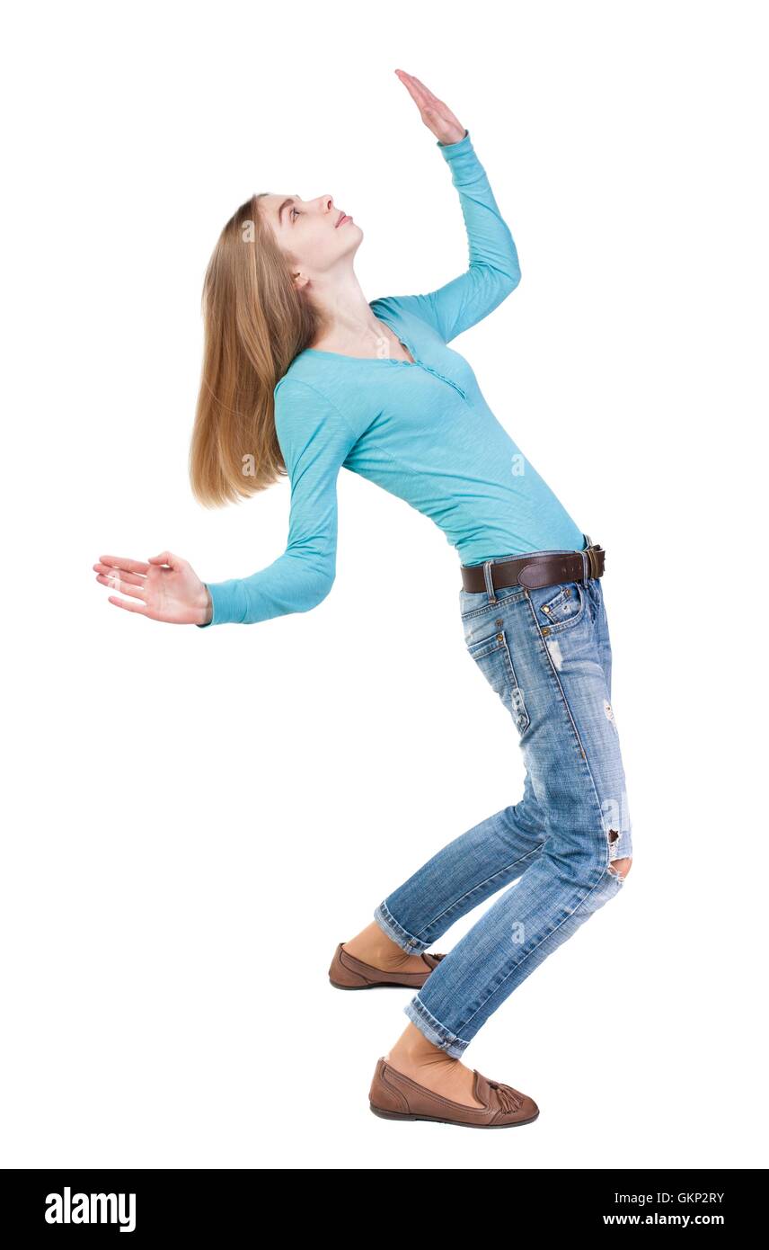 Balancing young woman. or dodge falling woman Stock Photo - Alamy