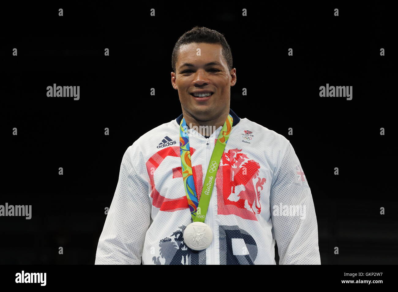 Great Britain's Joe Joyce with his silver medal following his defeat to ...