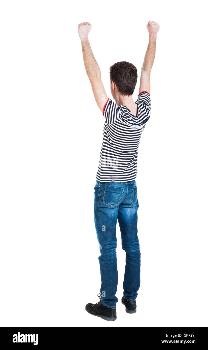 Back view of man. Raised his fist up in victory sign Stock Photo - Alamy