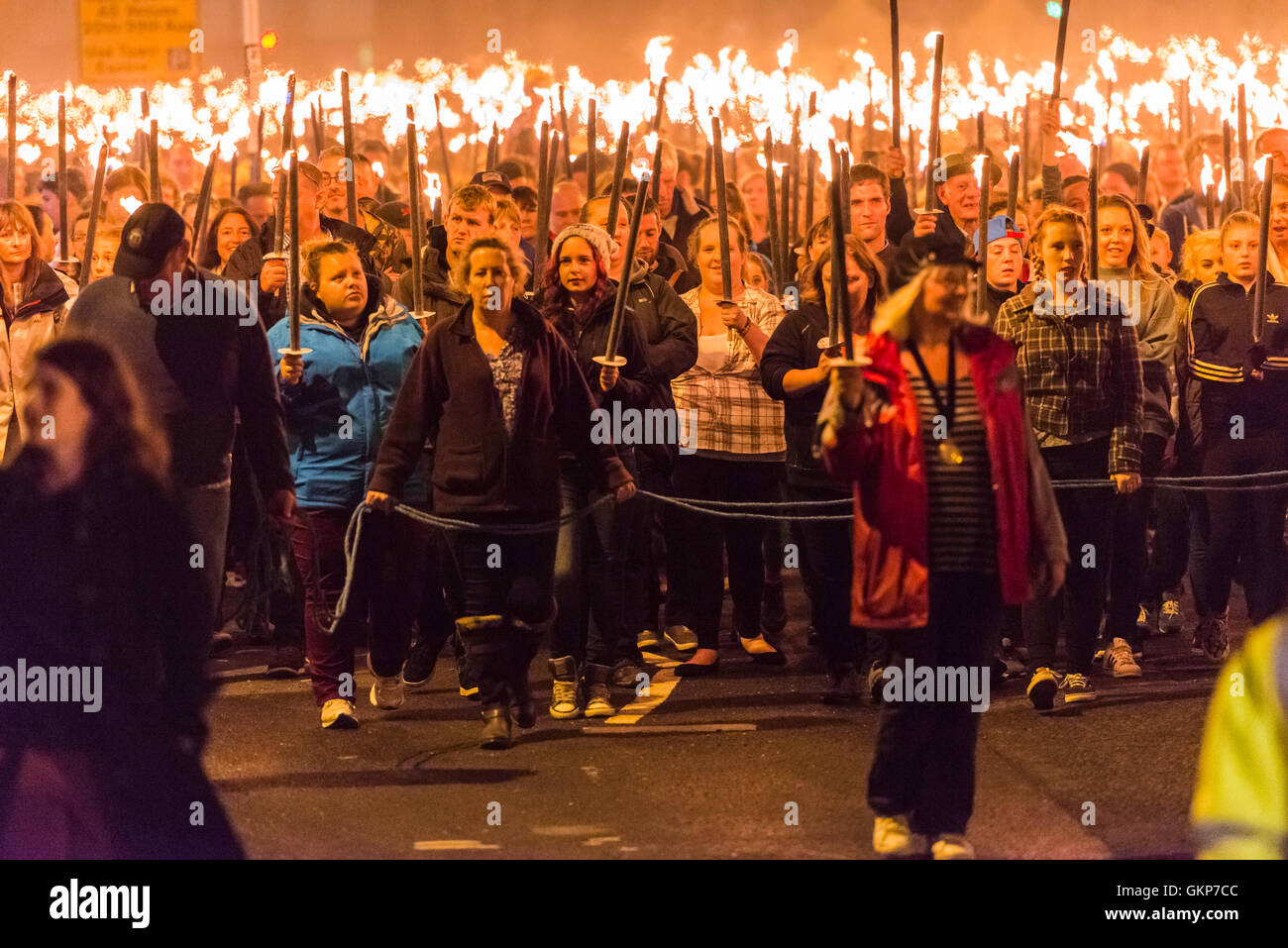Bridport, Dorset, UK. 21st Aug, 2016. Around 2,000 people with flaming ...
