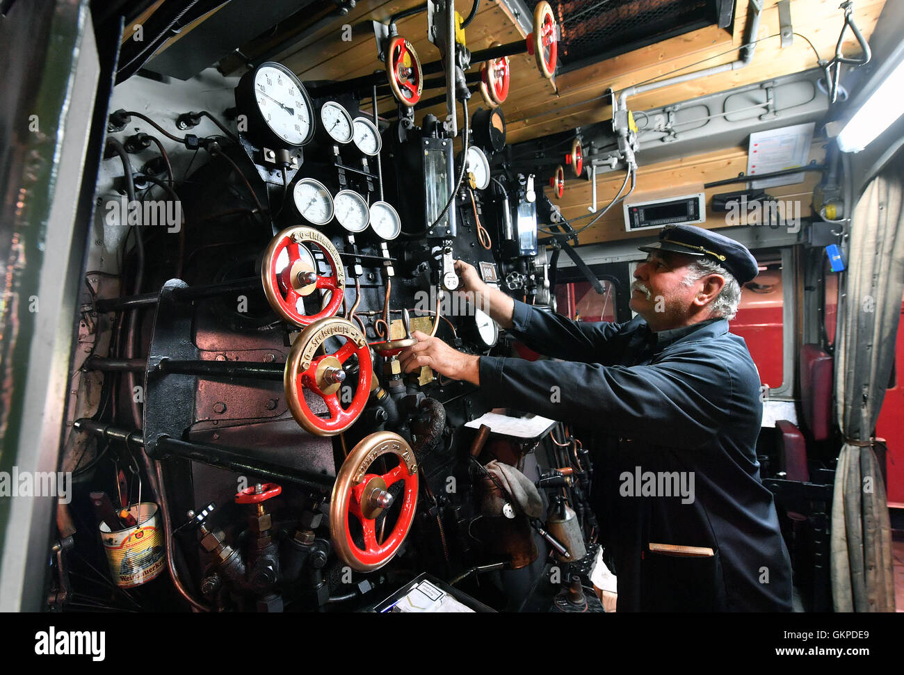 Peter Weisshahn, railway road operator since 1959 is sitting inside the ...