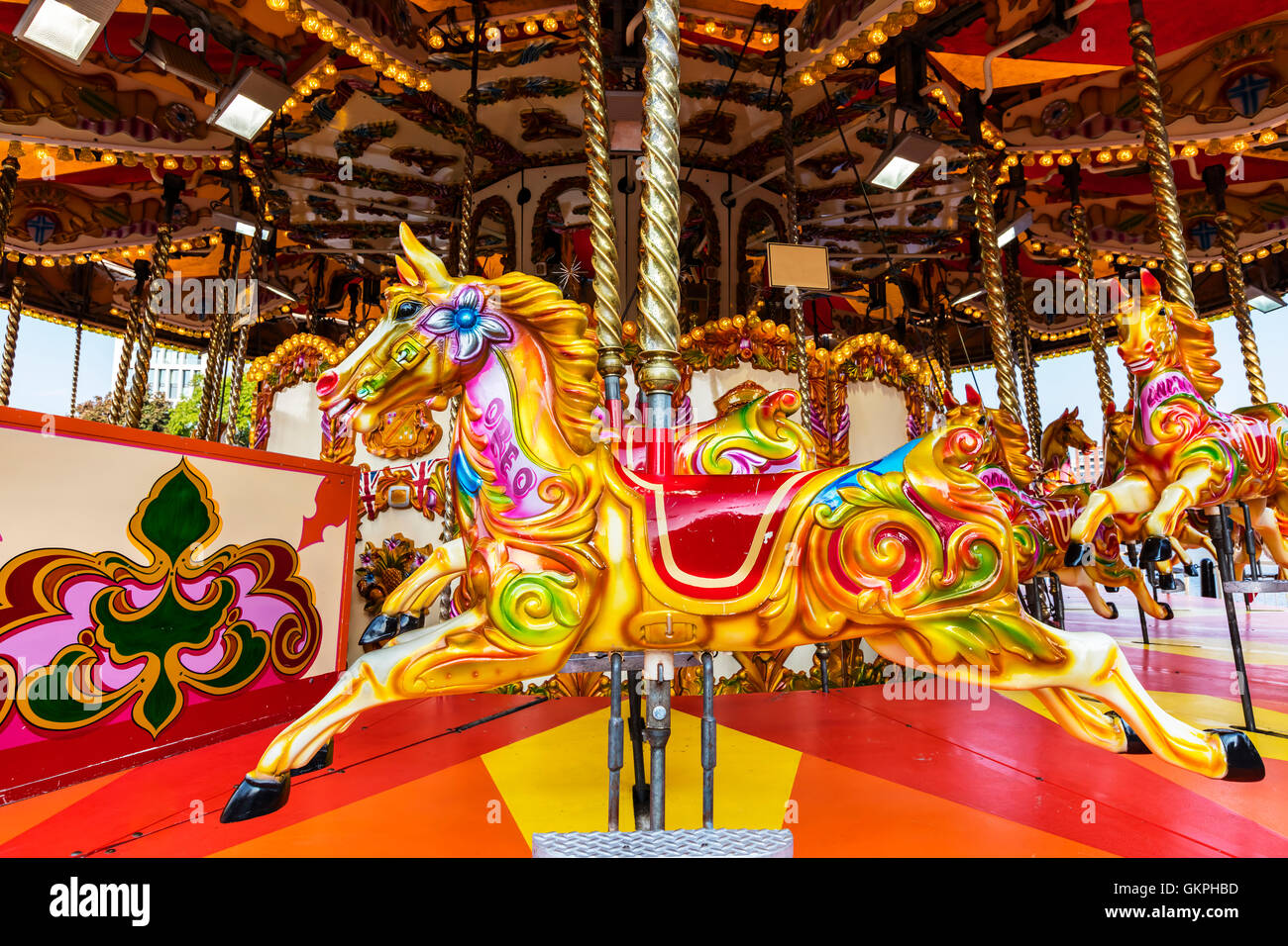 Brightly coloured vintage carousel pony Stock Photo - Alamy