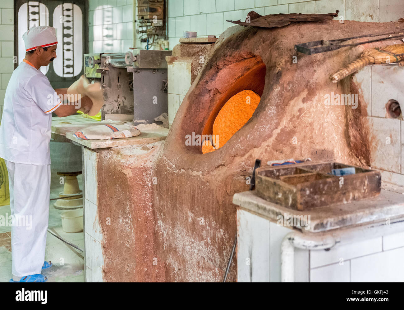 Persian baker baking beautiful Persian Taftoon Bread using Tandoor Oven ...