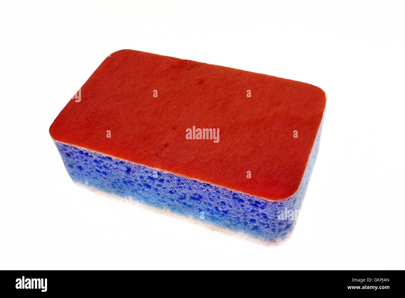 Sponge red and violet for washing dishes Stock Photo - Alamy