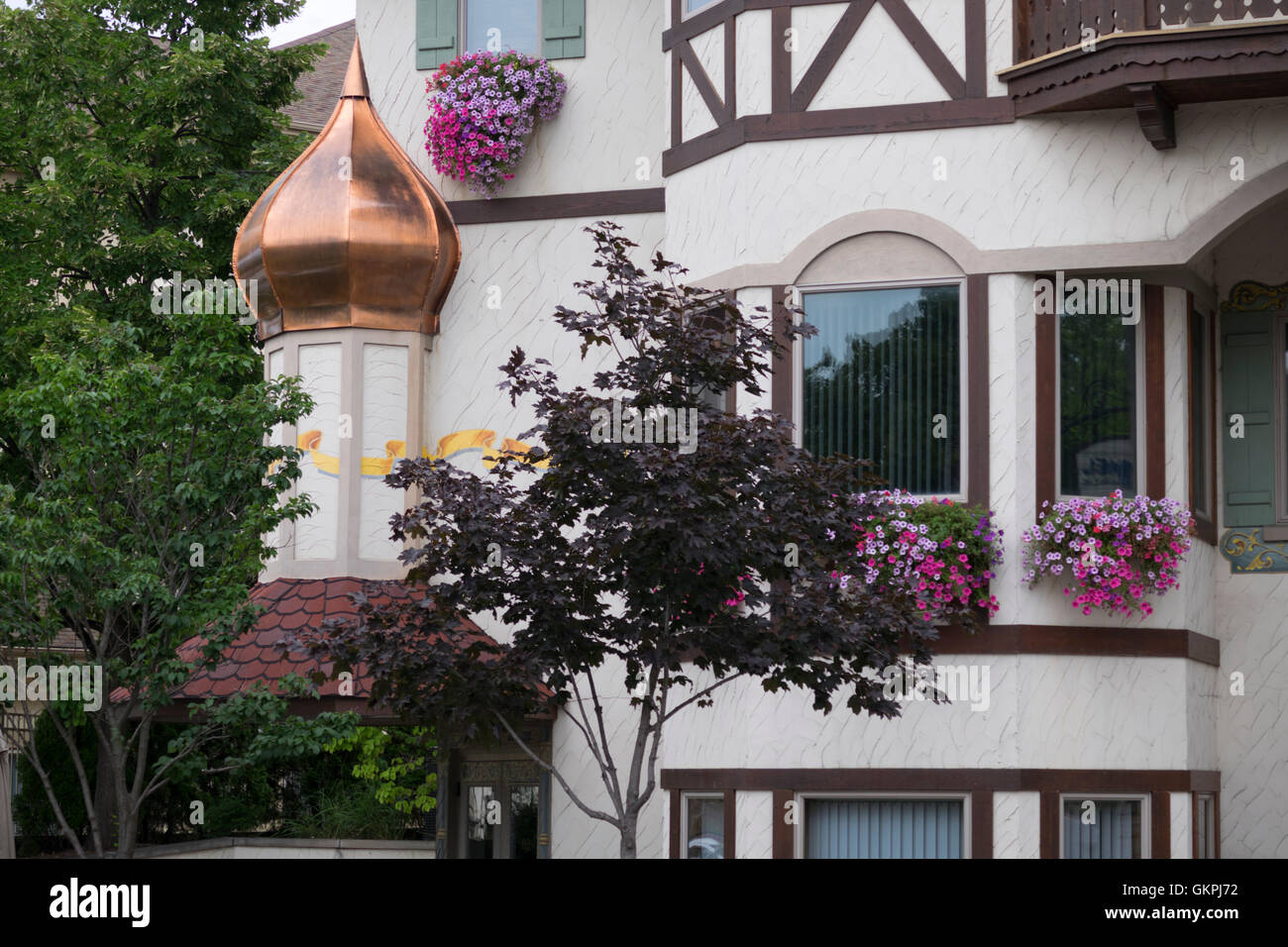 Copper dome or cap on a turret at the side of a bavarian style building ...
