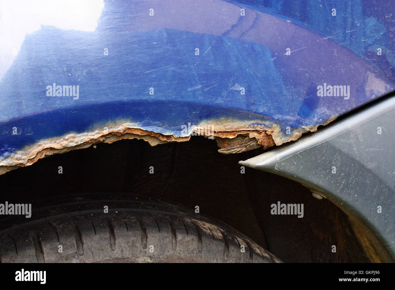 Heavily corroded rusty wheel arches in a blue car Stock Photo - Alamy