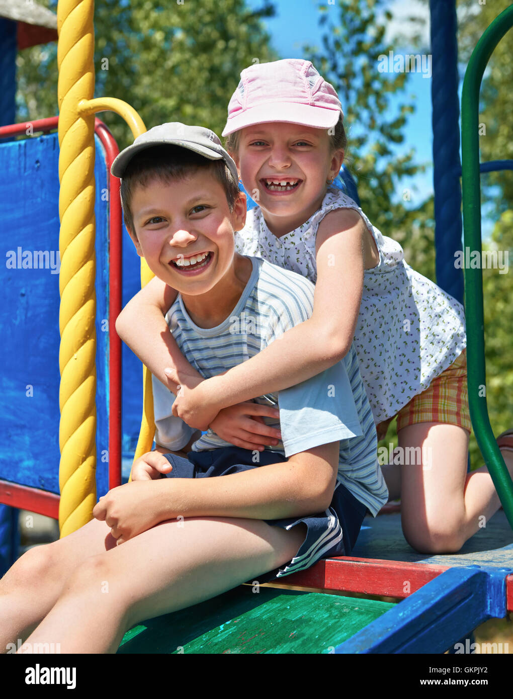 happy child on playground outdoor, play in city park, summer season ...
