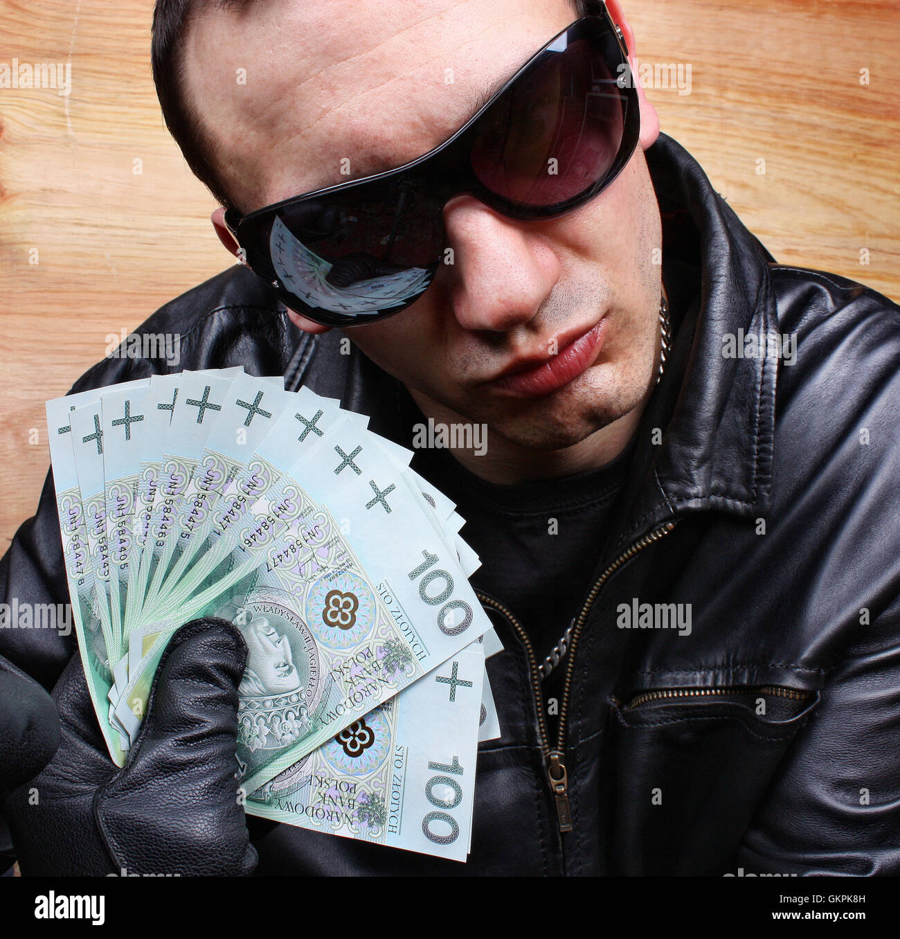 Mafia gangster with a fan polish money Stock Photo - Alamy