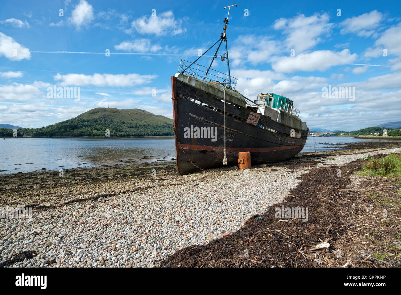 An old ship washed ashore on Loch Linnhe at Fort William on the Higland ...