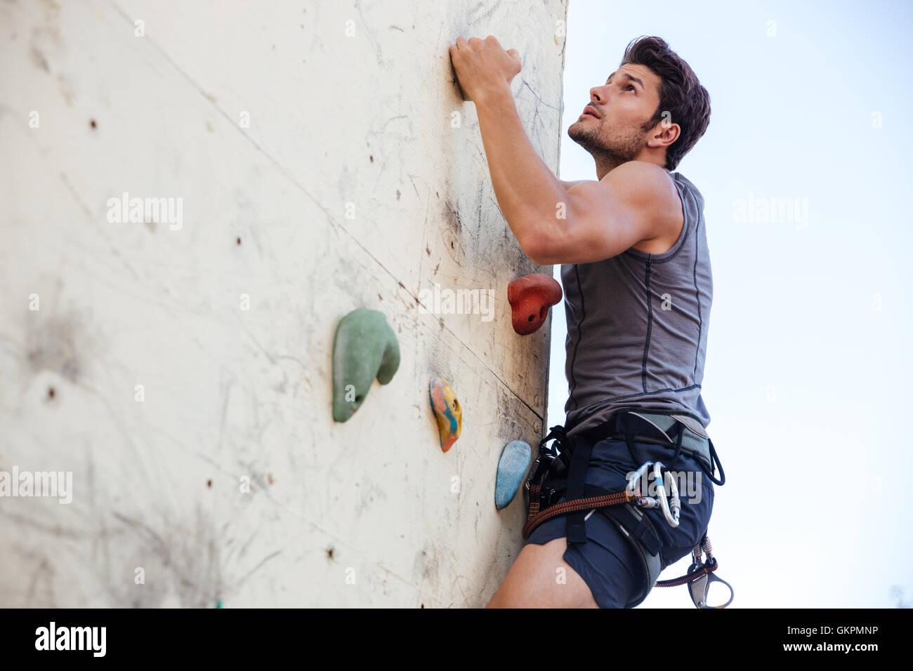 Young girl on an indoor climbing wall hi-res stock photography and ...