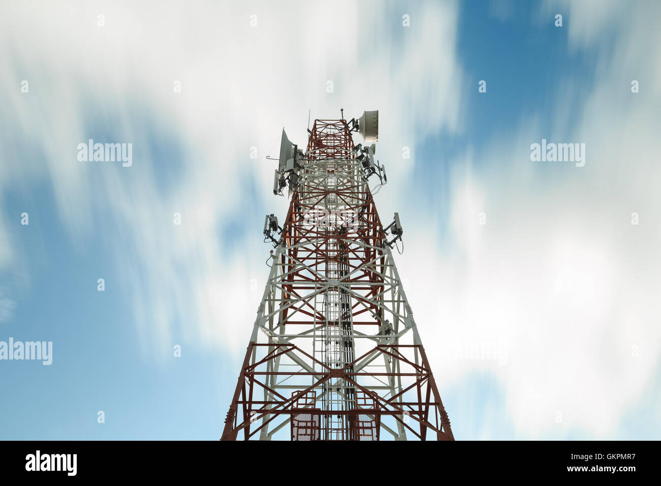 telecoms building tower under movement cloud with long exposure shot ...