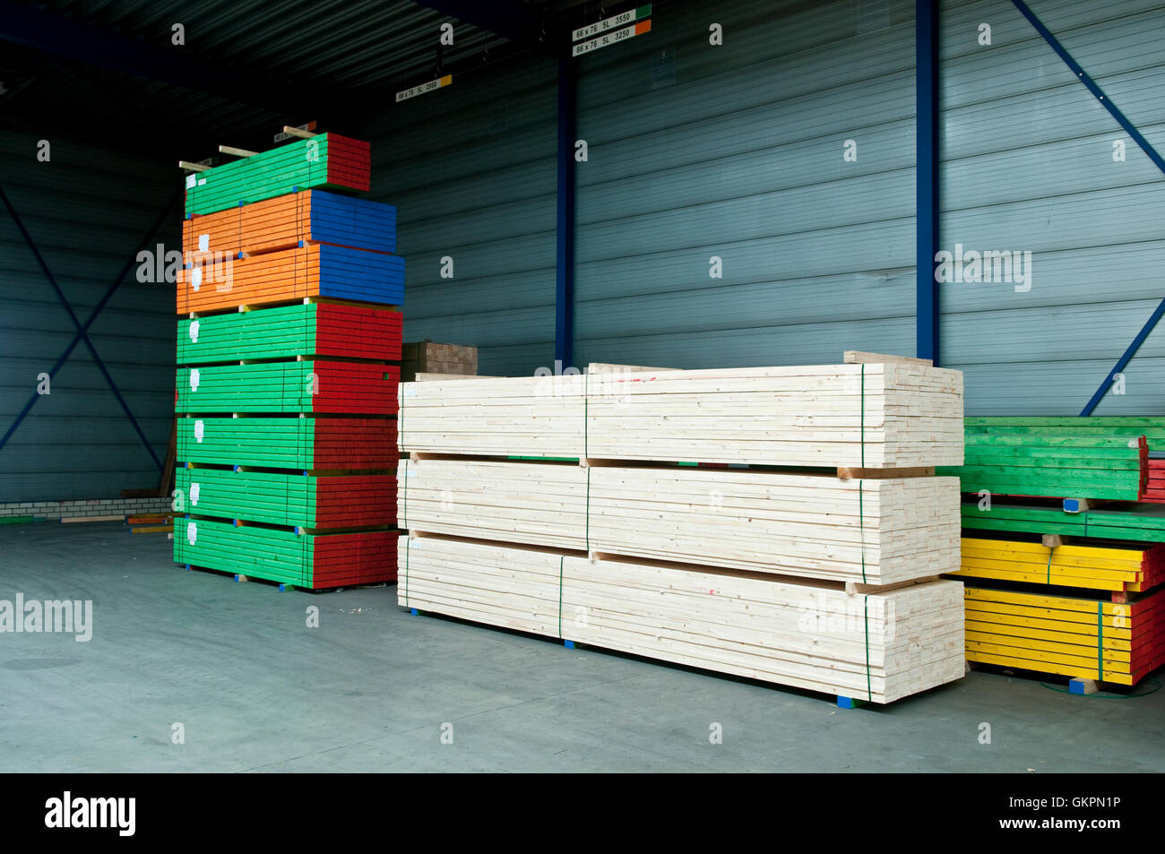 Stacked colour coded construction timber Stock Photo - Alamy