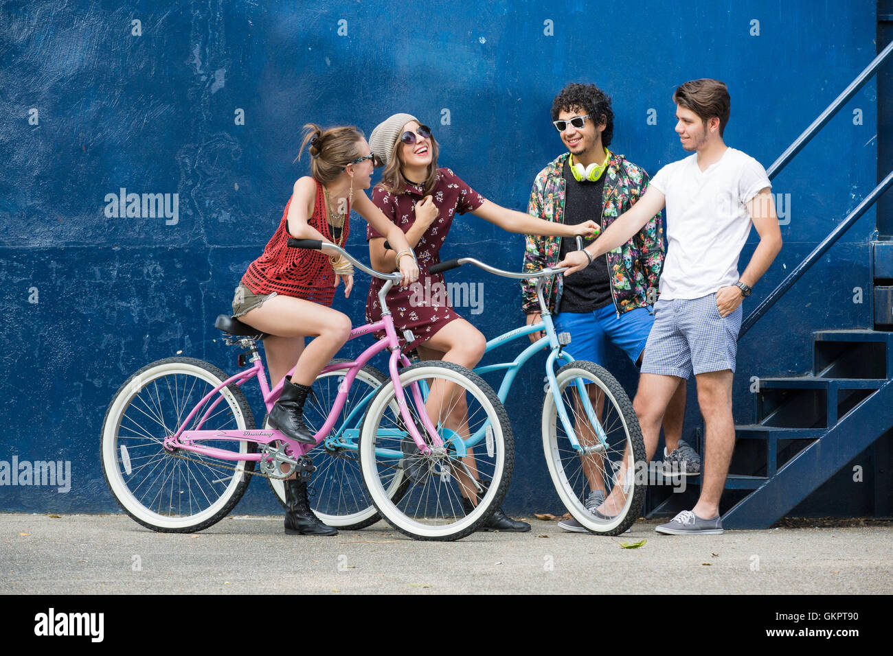 Four friends get together at park having fun and talking #2 Stock Photo ...