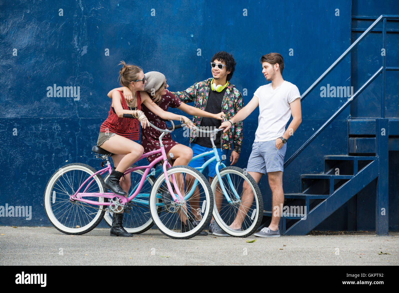 Four friends get together at park having fun #2 Stock Photo - Alamy