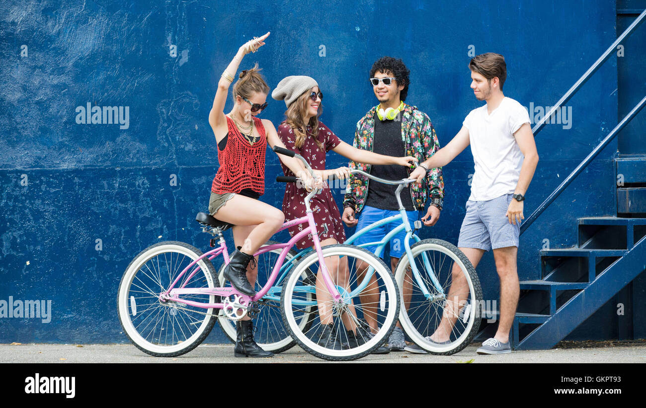 Four friends get together at park having fun #1 Stock Photo - Alamy