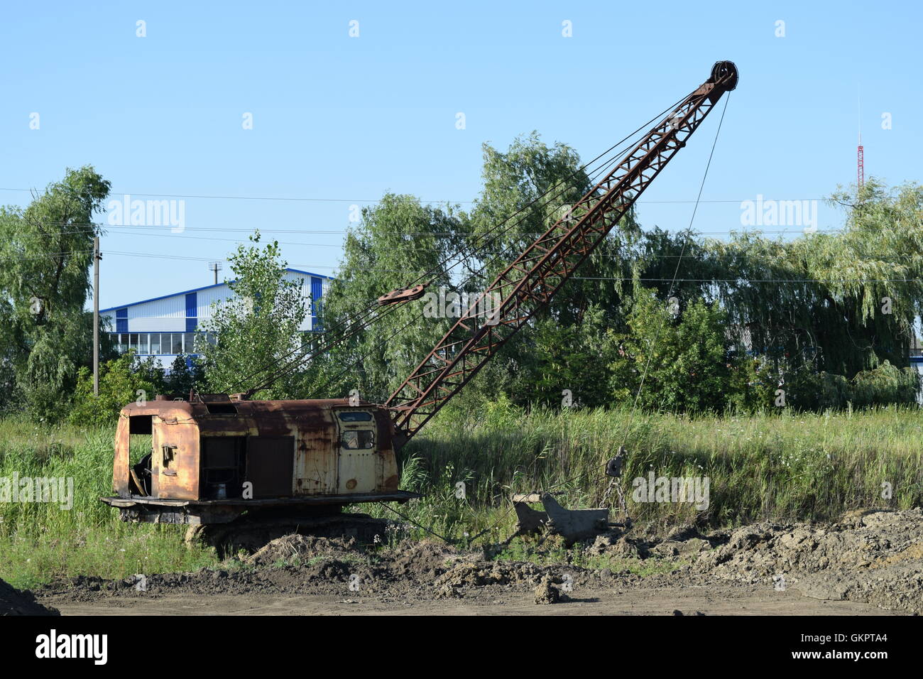 Old quarry near the dragline. Old equipment for digging the soil in ...
