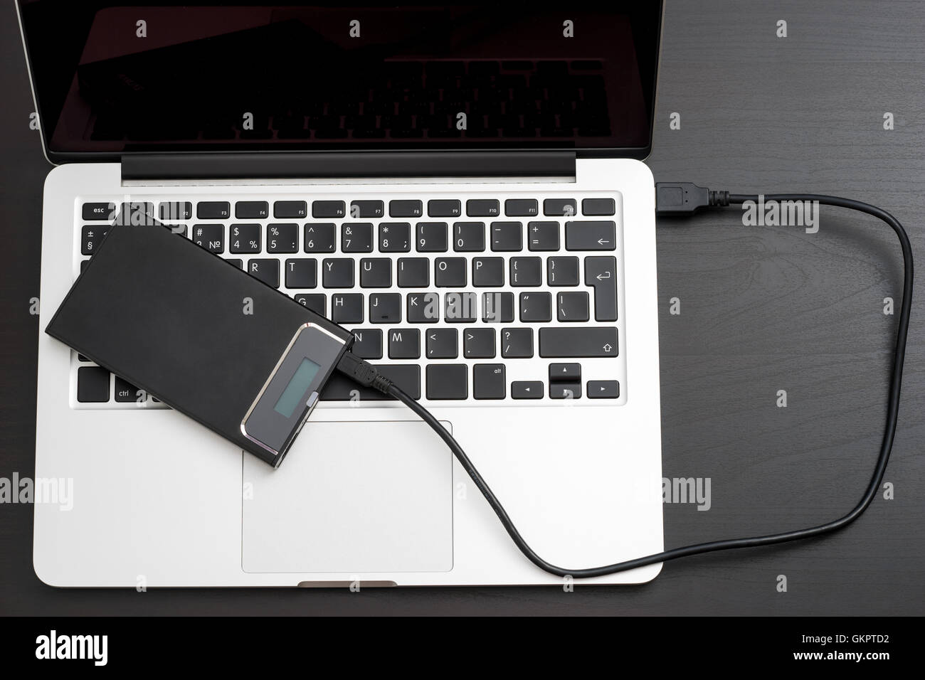 External hard disk over laptop keyboard Stock Photo - Alamy