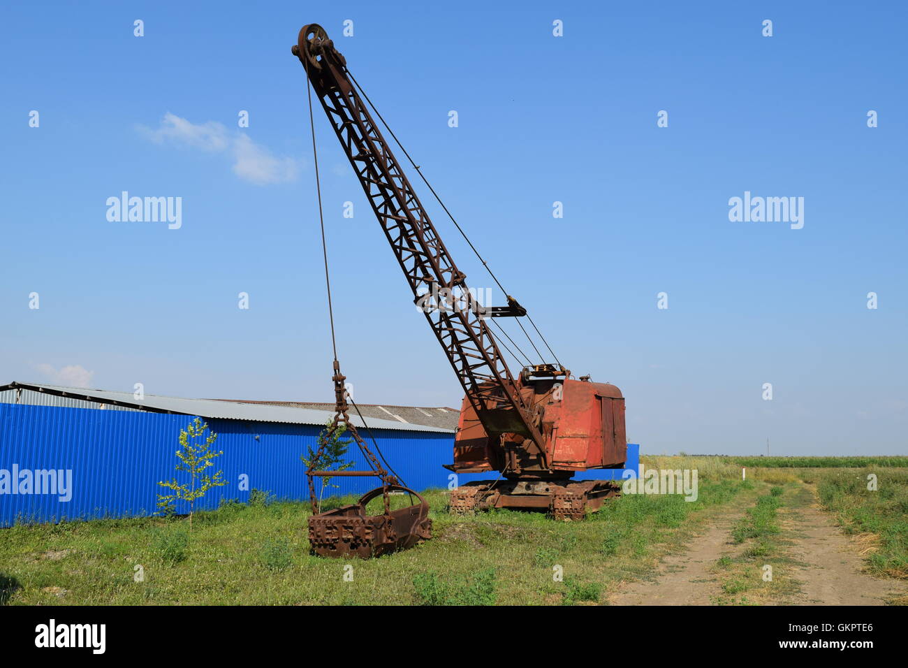 Old quarry near the dragline. Old equipment for digging the soil in ...
