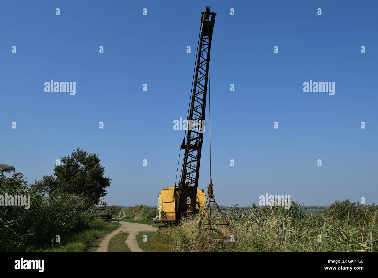Old quarry near the dragline. Old equipment for digging the soil in ...