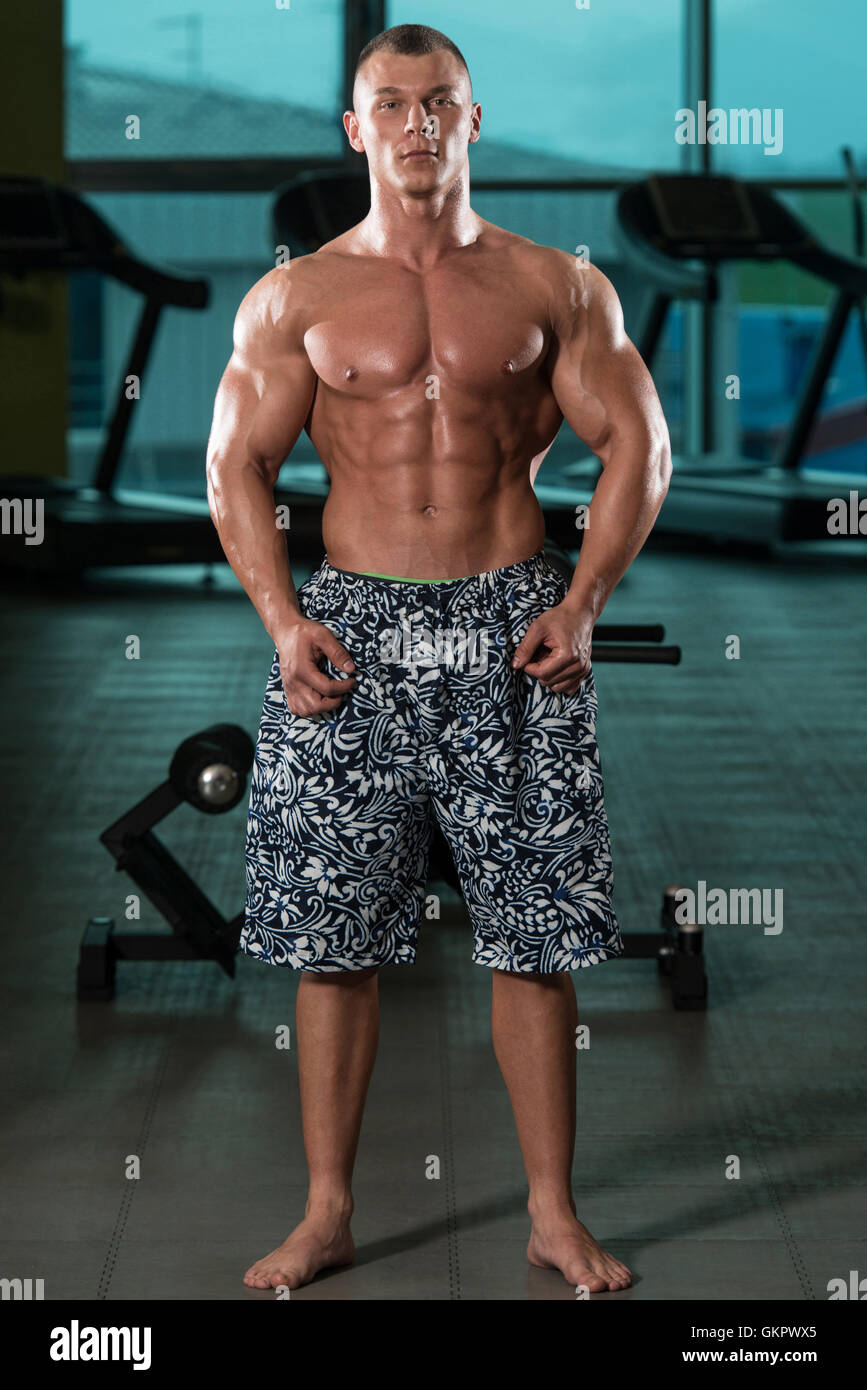 Bodybuilder Posing In Different Poses Demonstrating Their Muscles ...