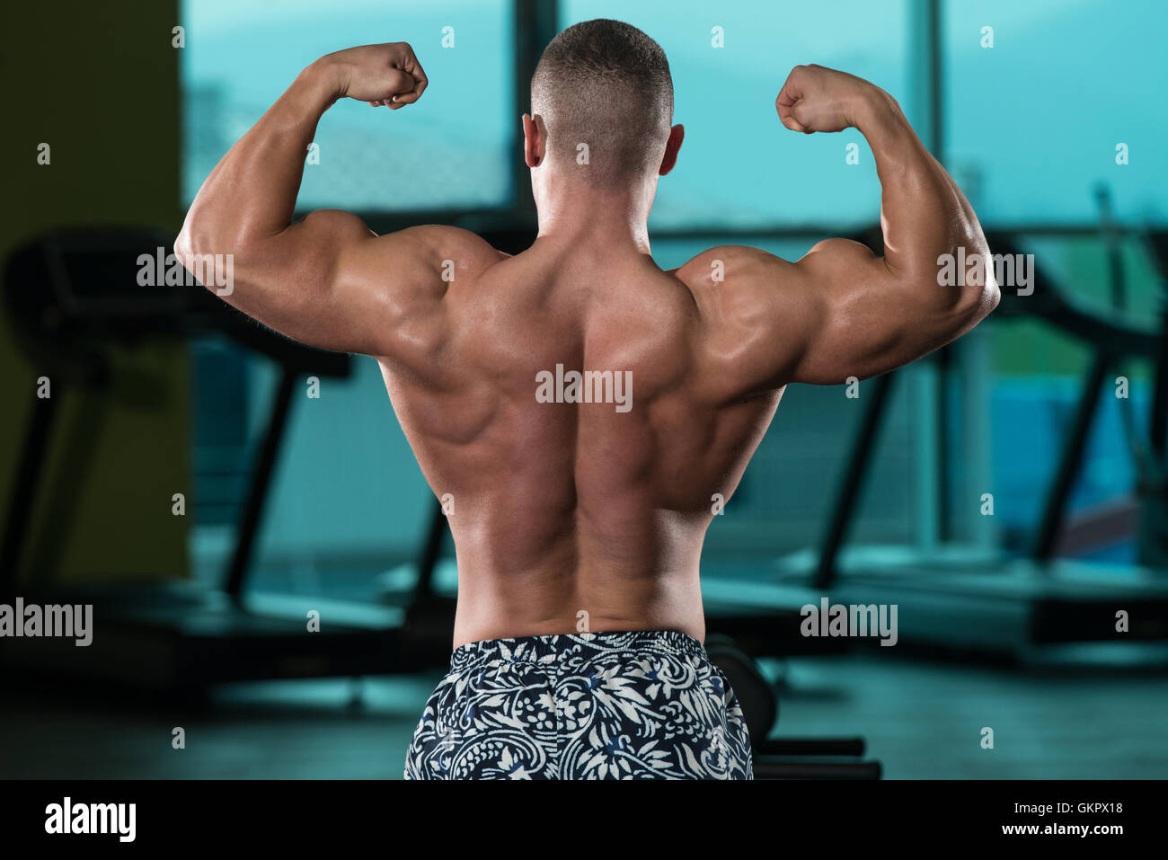 Bodybuilder Posing In Different Poses Demonstrating Their Muscles ...