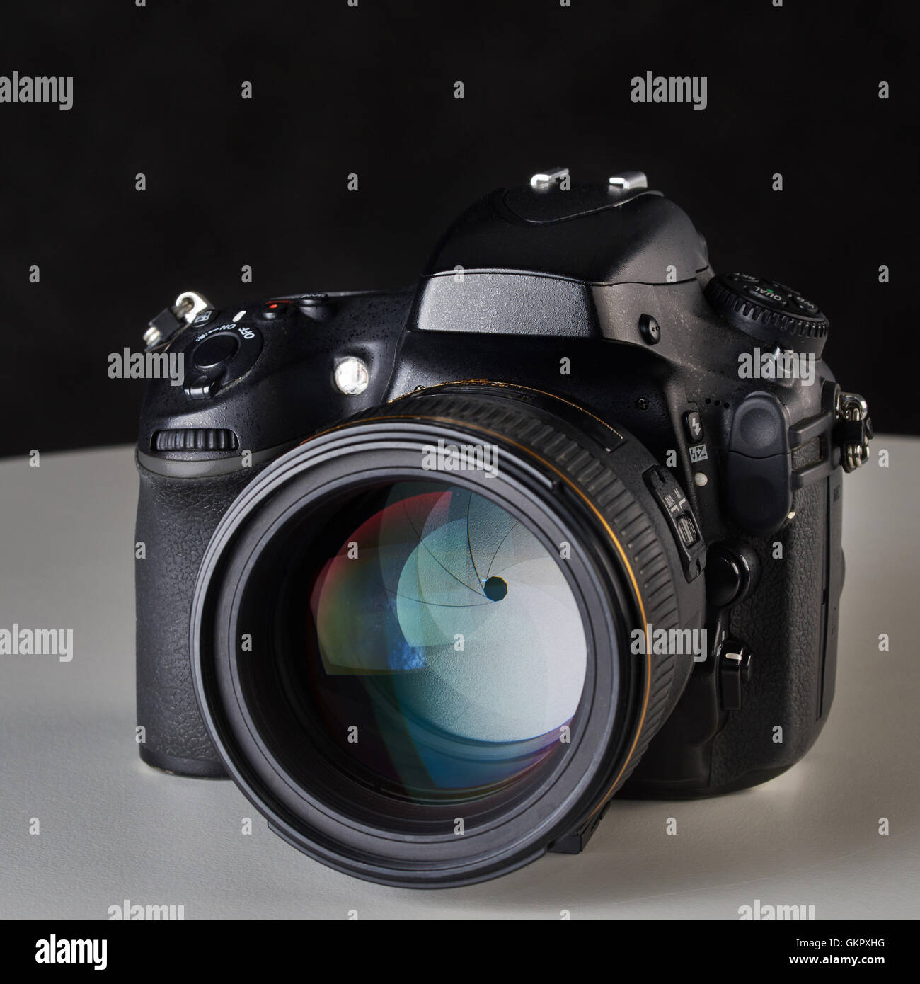 DSLR camera with big aperture ratio lens on black Stock Photo - Alamy