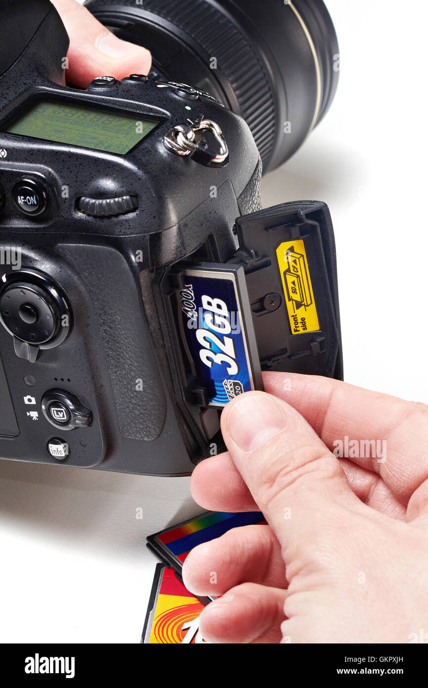 Set flash cards CF in DSLR camera close-up Stock Photo - Alamy