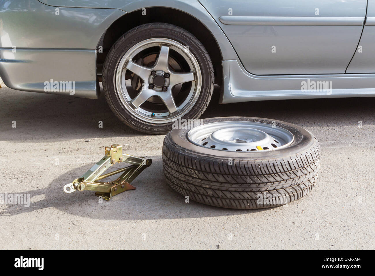 Change spare wheels Stock Photo - Alamy