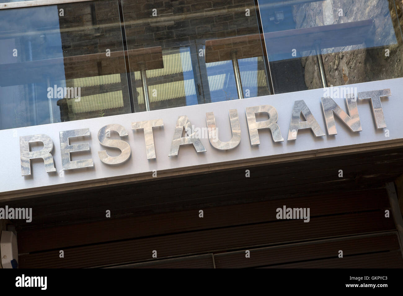 Restaurant Sign on Building Wall Stock Photo - Alamy