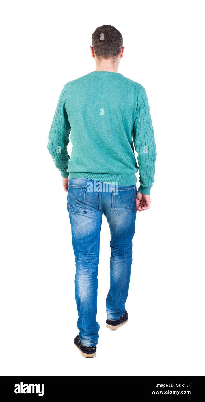 Back view of going handsome man in jeans and a shirt Stock Photo - Alamy