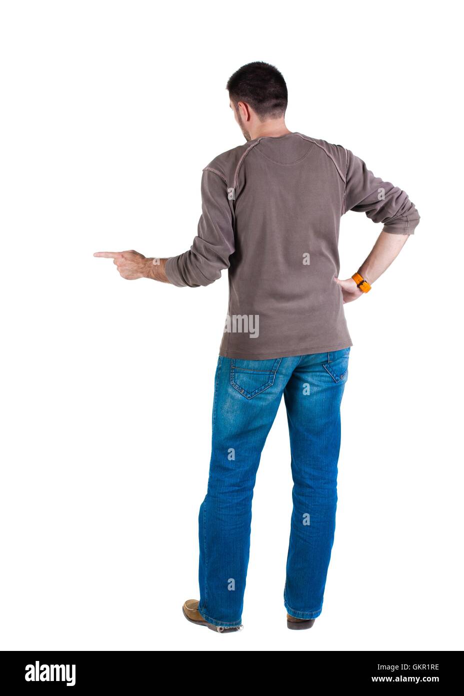 young man pointing at wall. rear view Stock Photo - Alamy