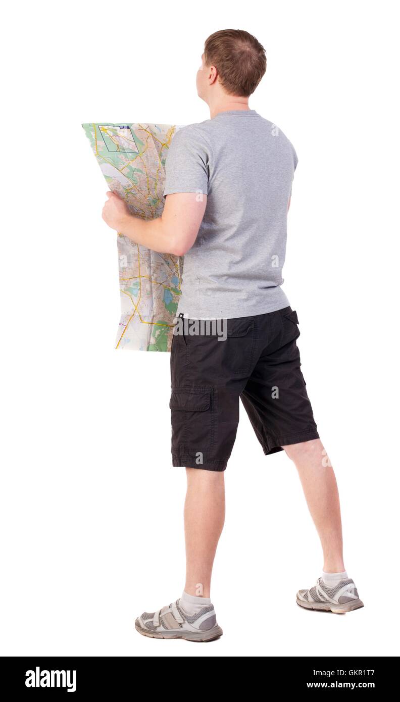 Back view of journey young man looking at the map Stock Photo - Alamy