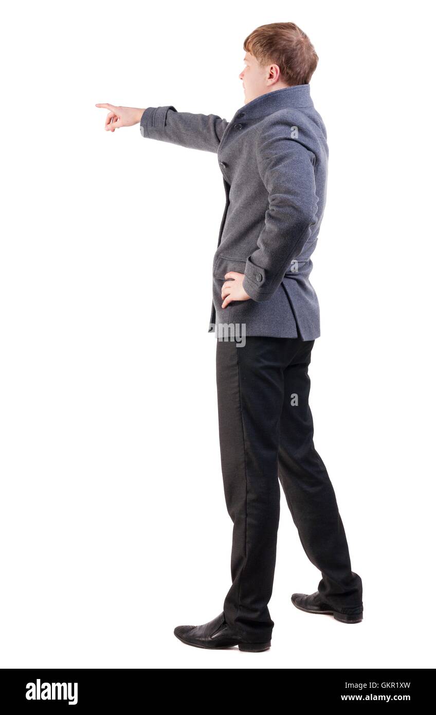 Back view of pointing young business men in coat Stock Photo - Alamy